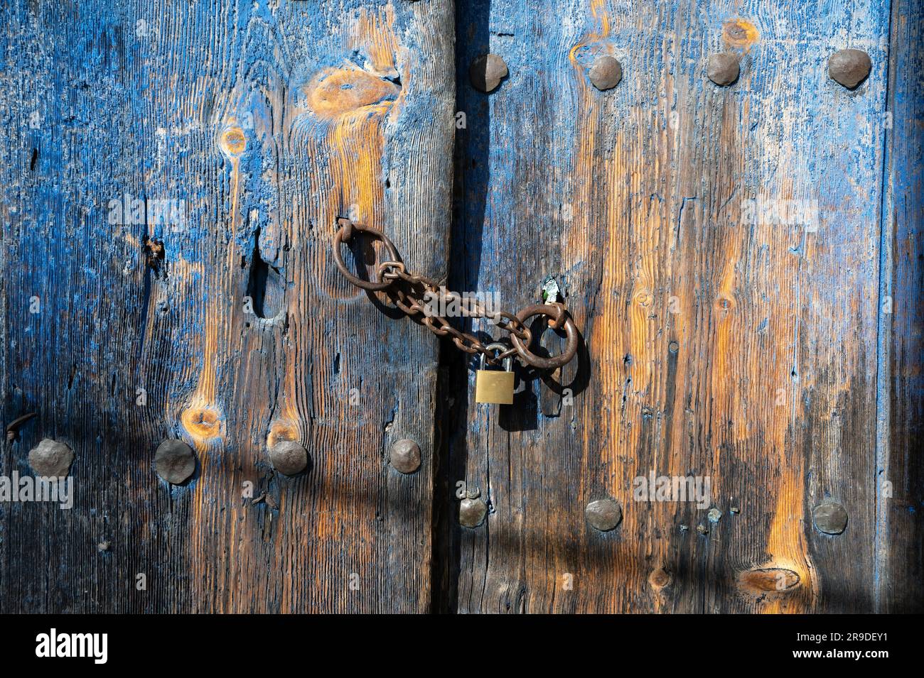 Wooden door of an old stone house in the traditional village of ...