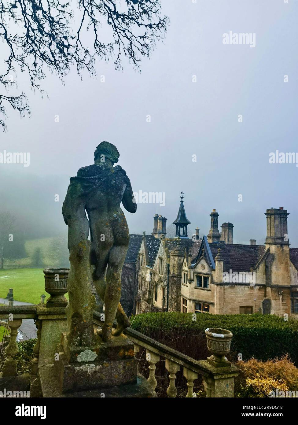 A close-up view of a stone statue in front of an ancient castle Stock ...