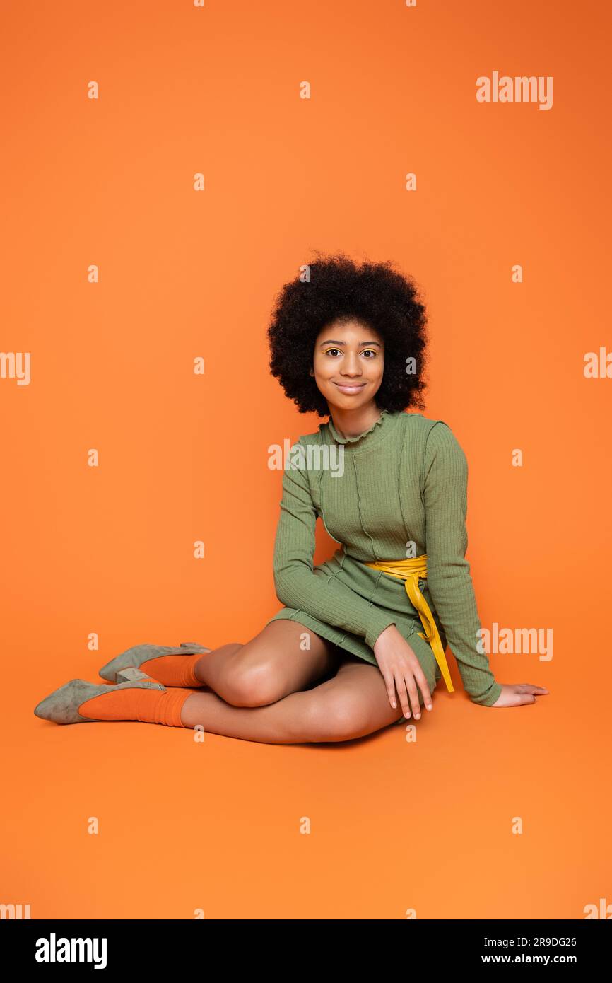 Full length of teen african american model with bold makeup wearing ...