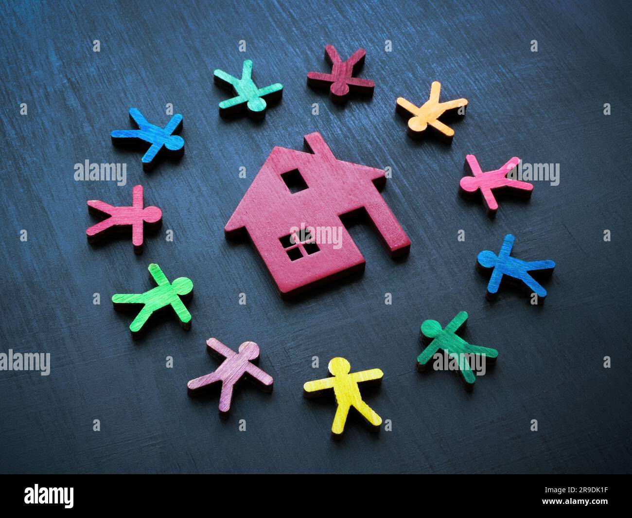 Home and colorful figurines around. Diversity and unity concept Stock ...