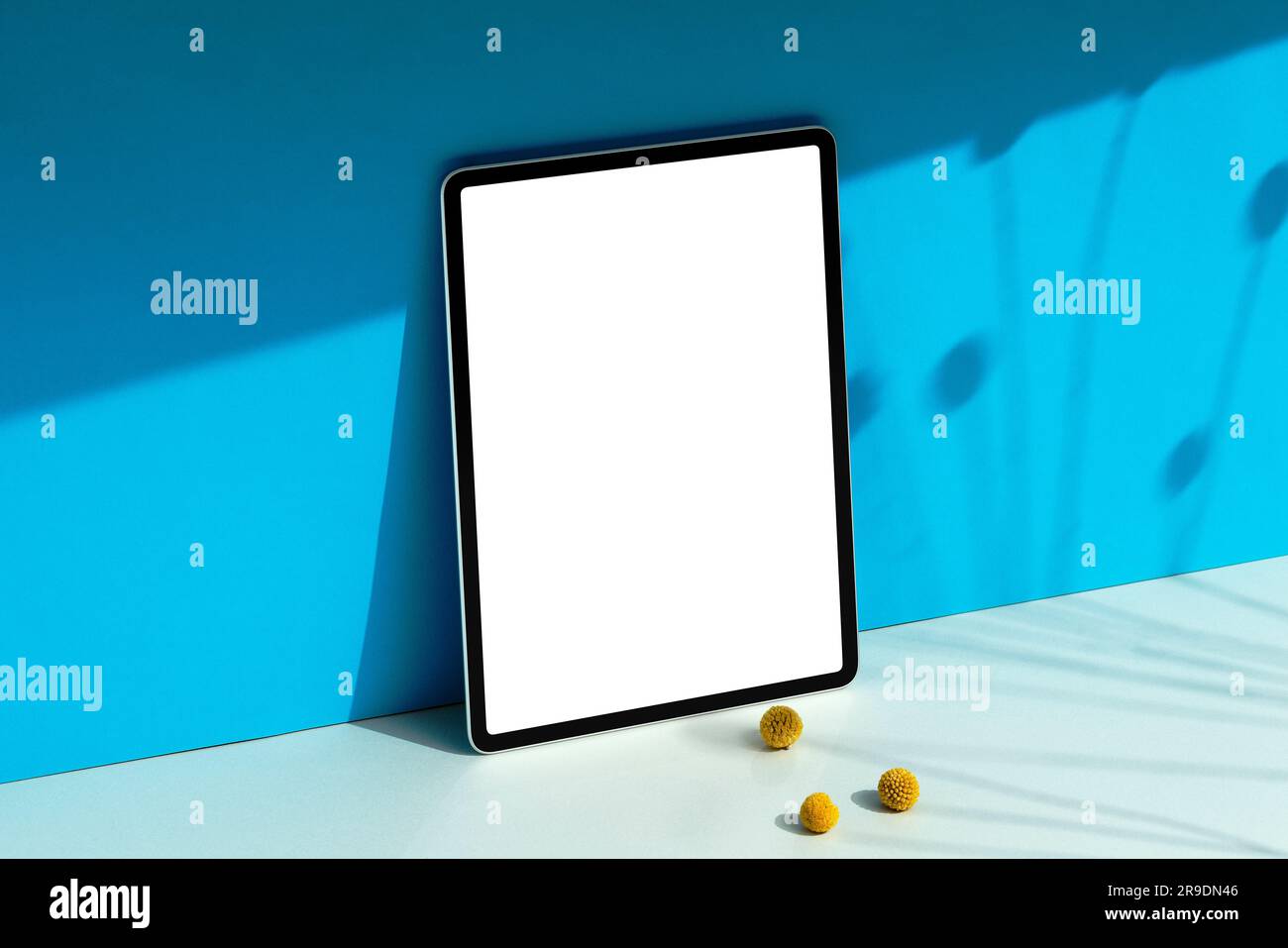 Digital tablet mockup with blank white screen on blue background with ...