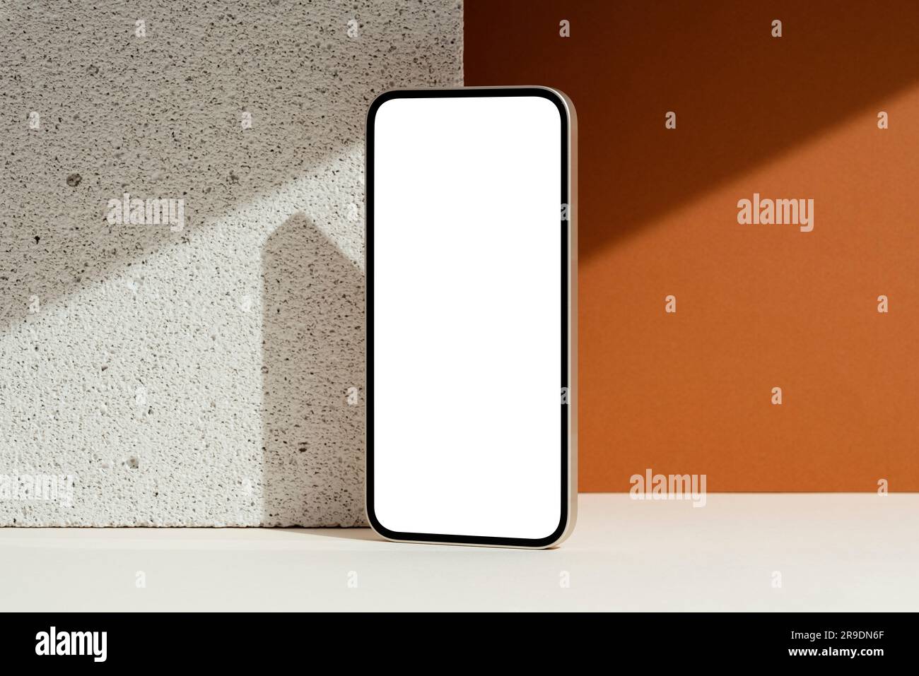 Blank screen smartphone mockup on brown background with sun and shade ...