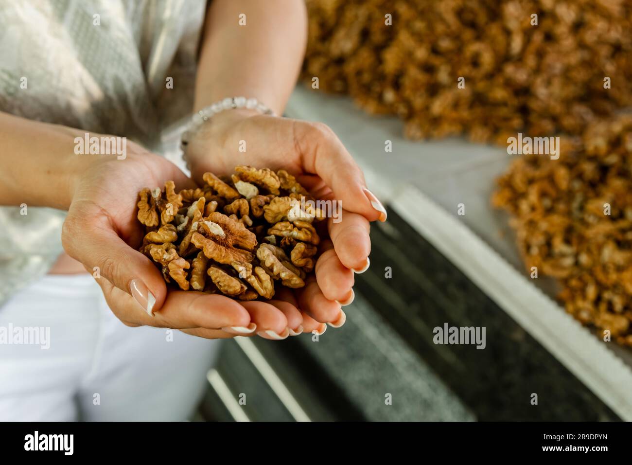 Unrecognisable woman buying walnuts in a supermarket. Healthy eating ...