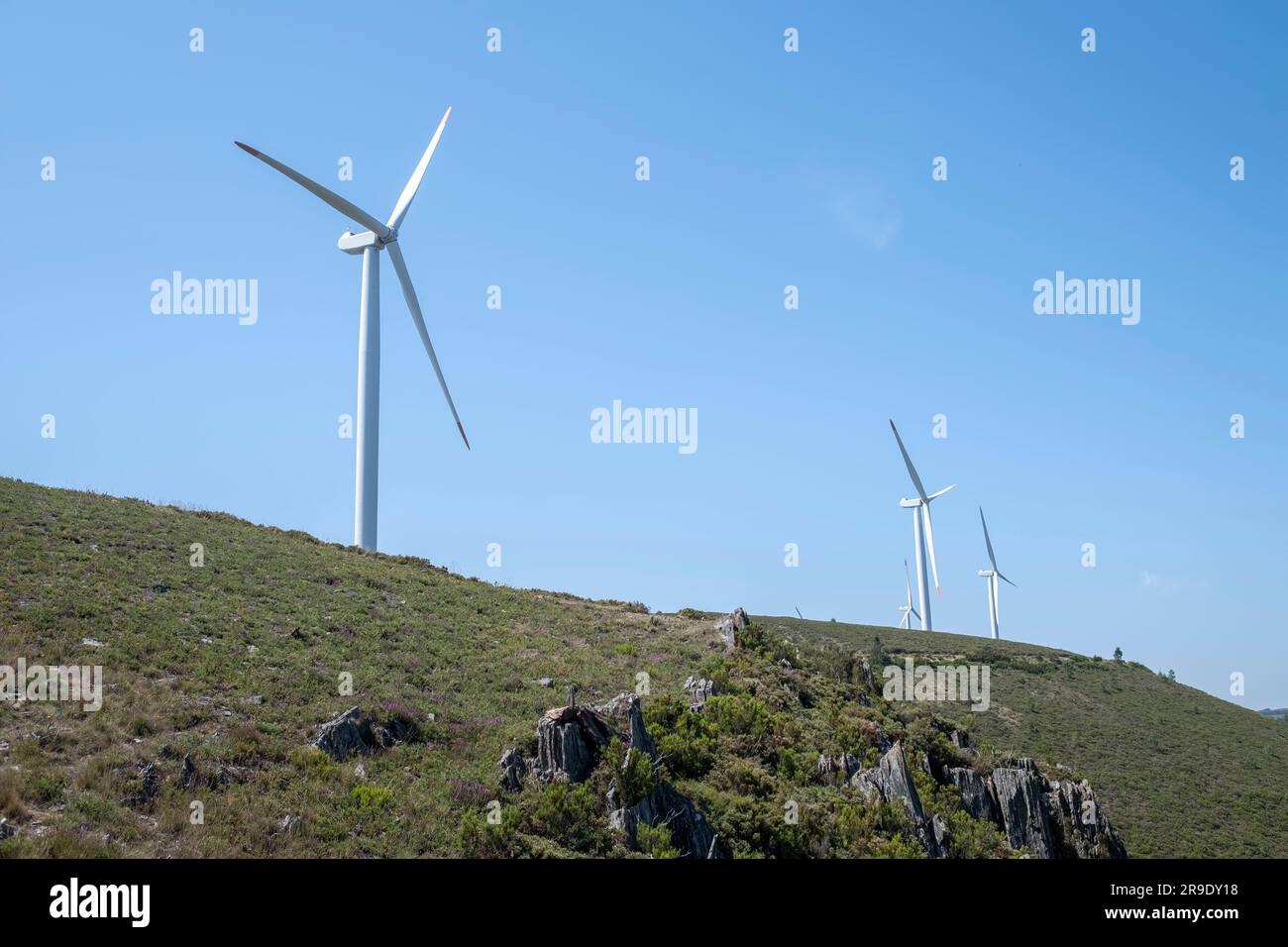 Wind power stations in the mountains. Wind farms Stock Photo - Alamy