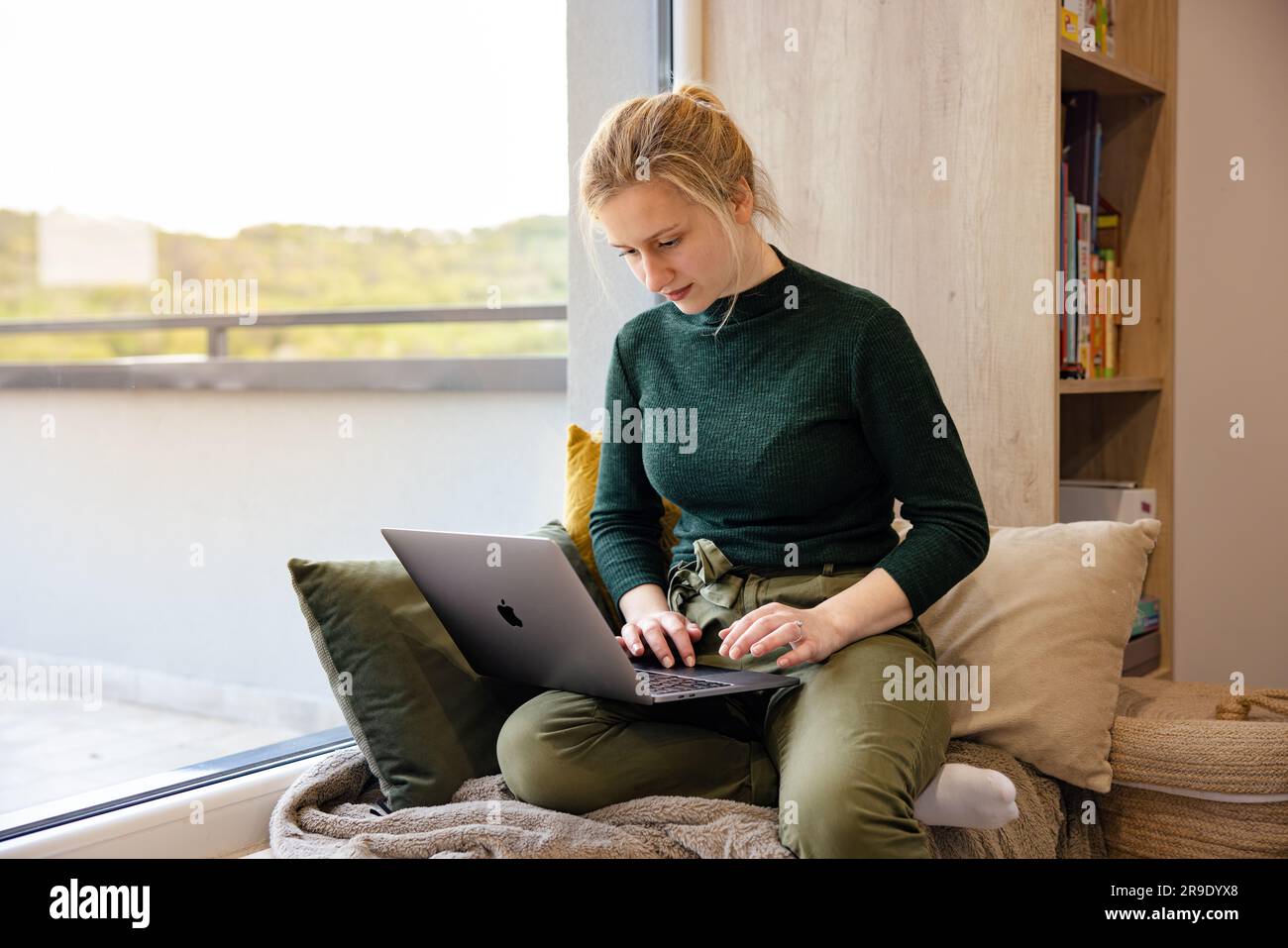 Woman trying to balance hi-res stock photography and images - Alamy