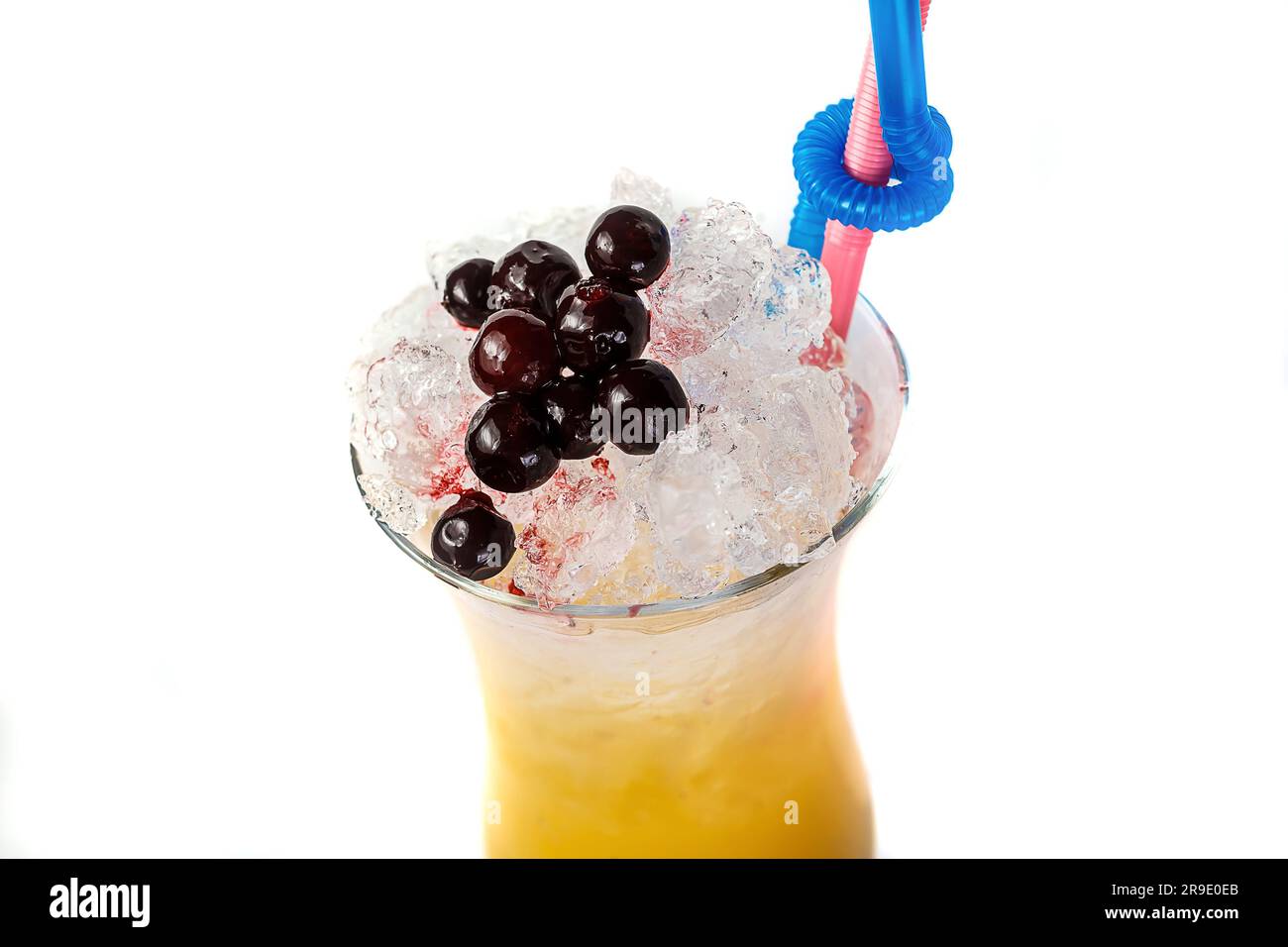 A tall glass of icy cold refreshment filled with fresh berries, perfect ...
