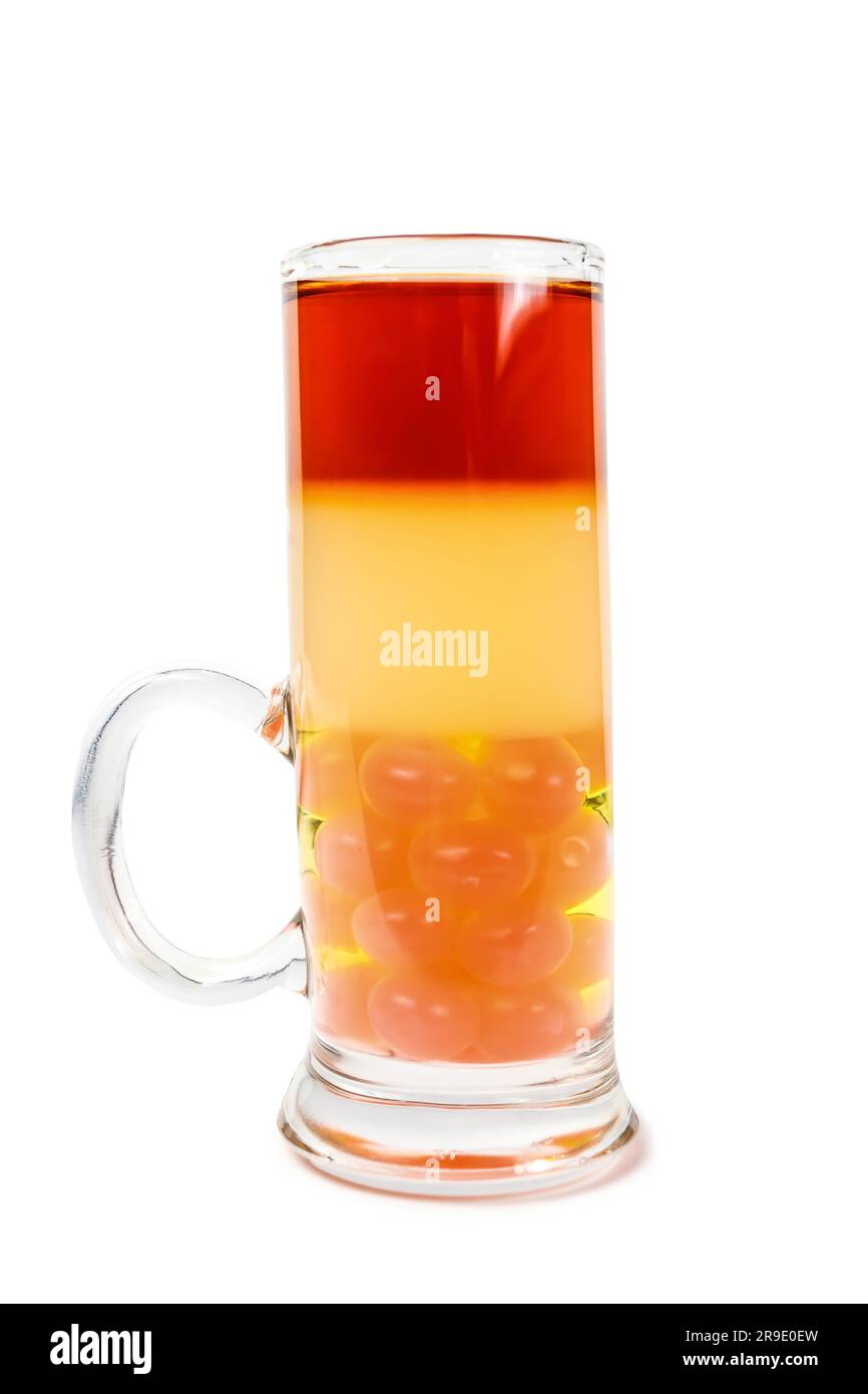 A perfect studio shot of a three ingredient red cocktail in a beer ...