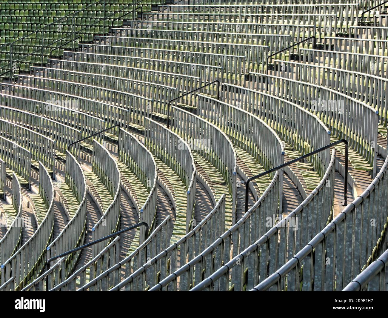 A close-up view of a steel staircase in a stadium setting, with metal ...