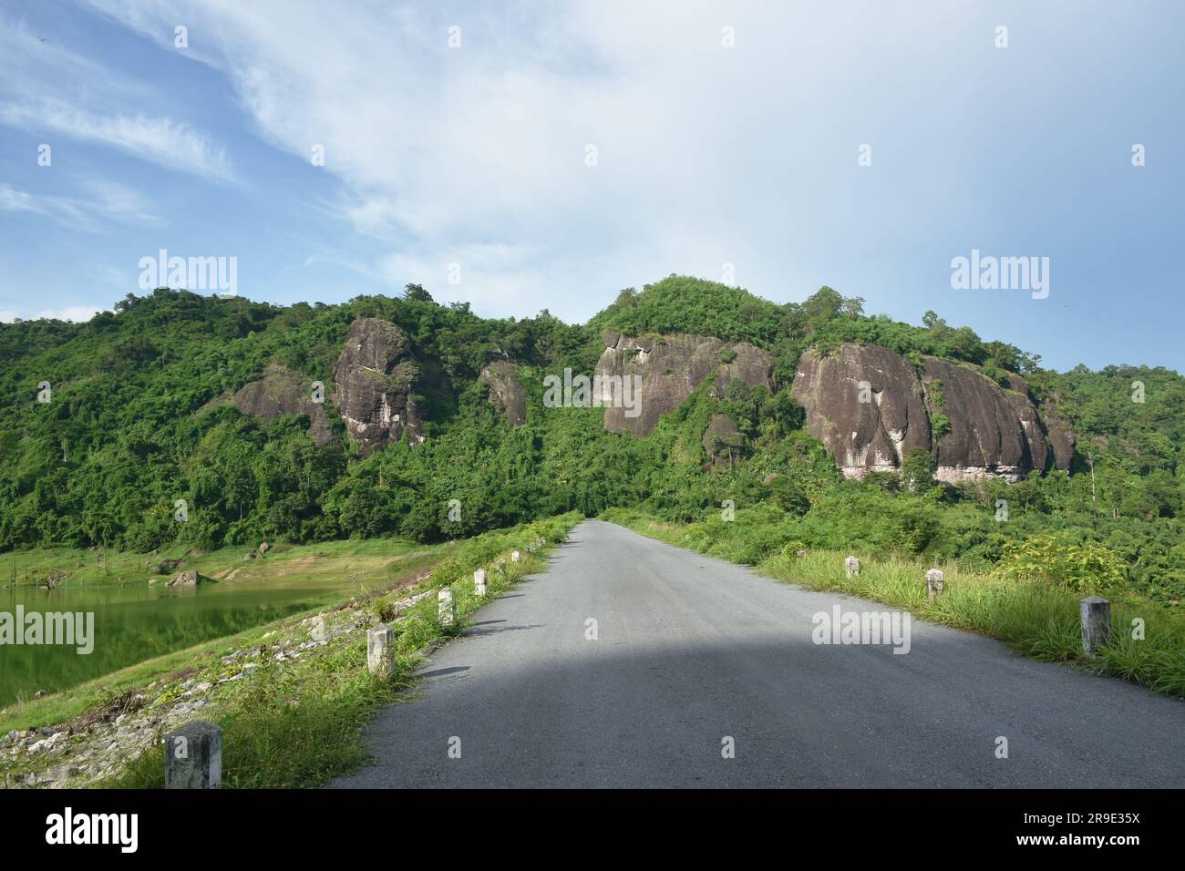 landscape of road at Klong Klang water reservoir lake with mountain ...