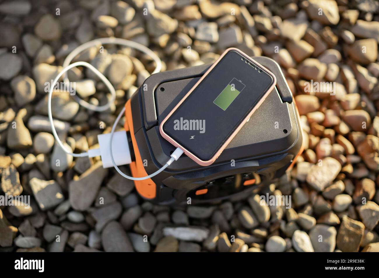 Close up view of handheld device with green status on screen being ...