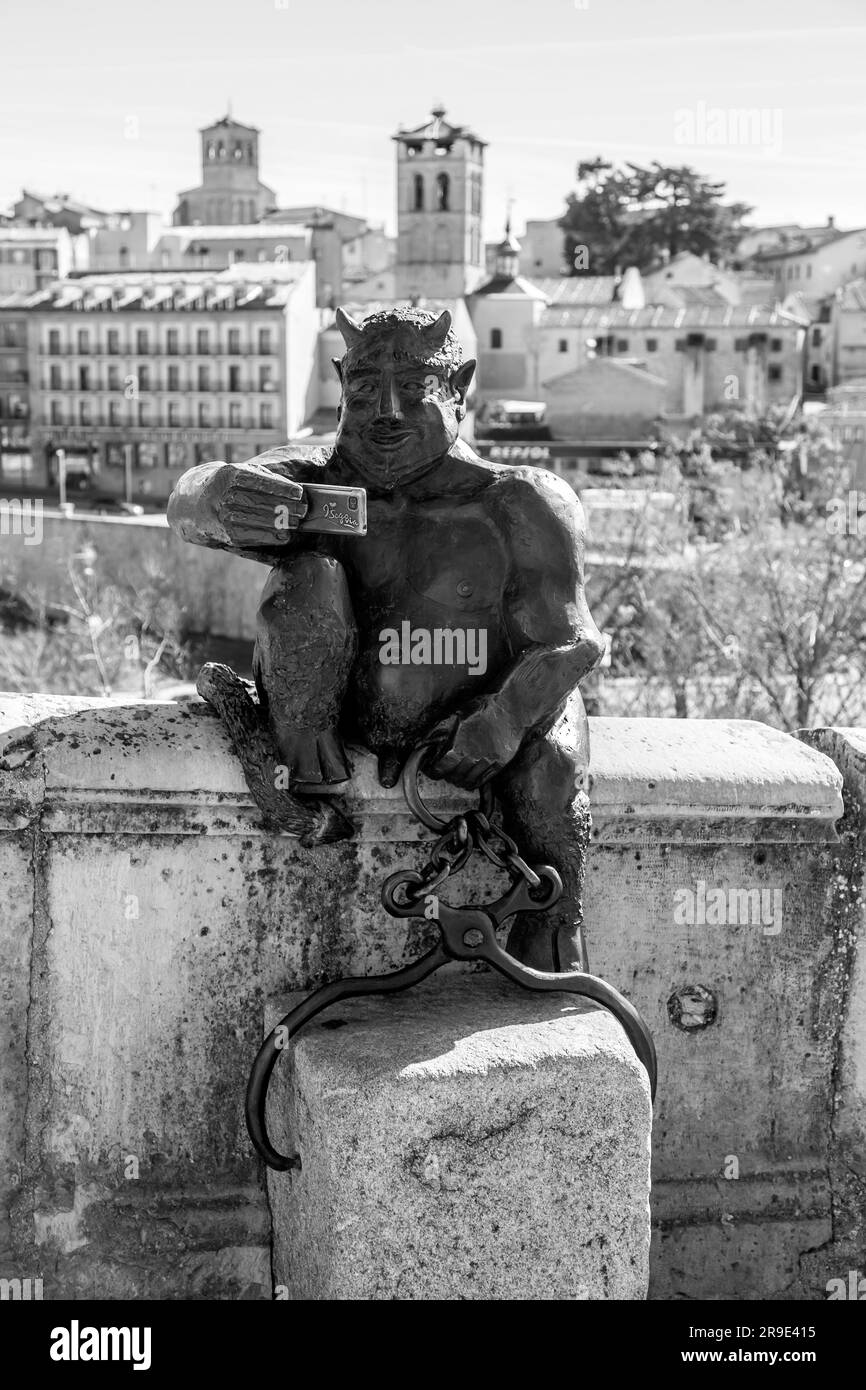 Segovia, Spain - FEB 18, 2022: Funny sculpture of a devil taking a ...