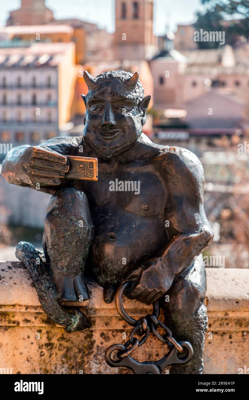 Segovia, Spain - FEB 18, 2022: Funny sculpture of a devil taking a ...