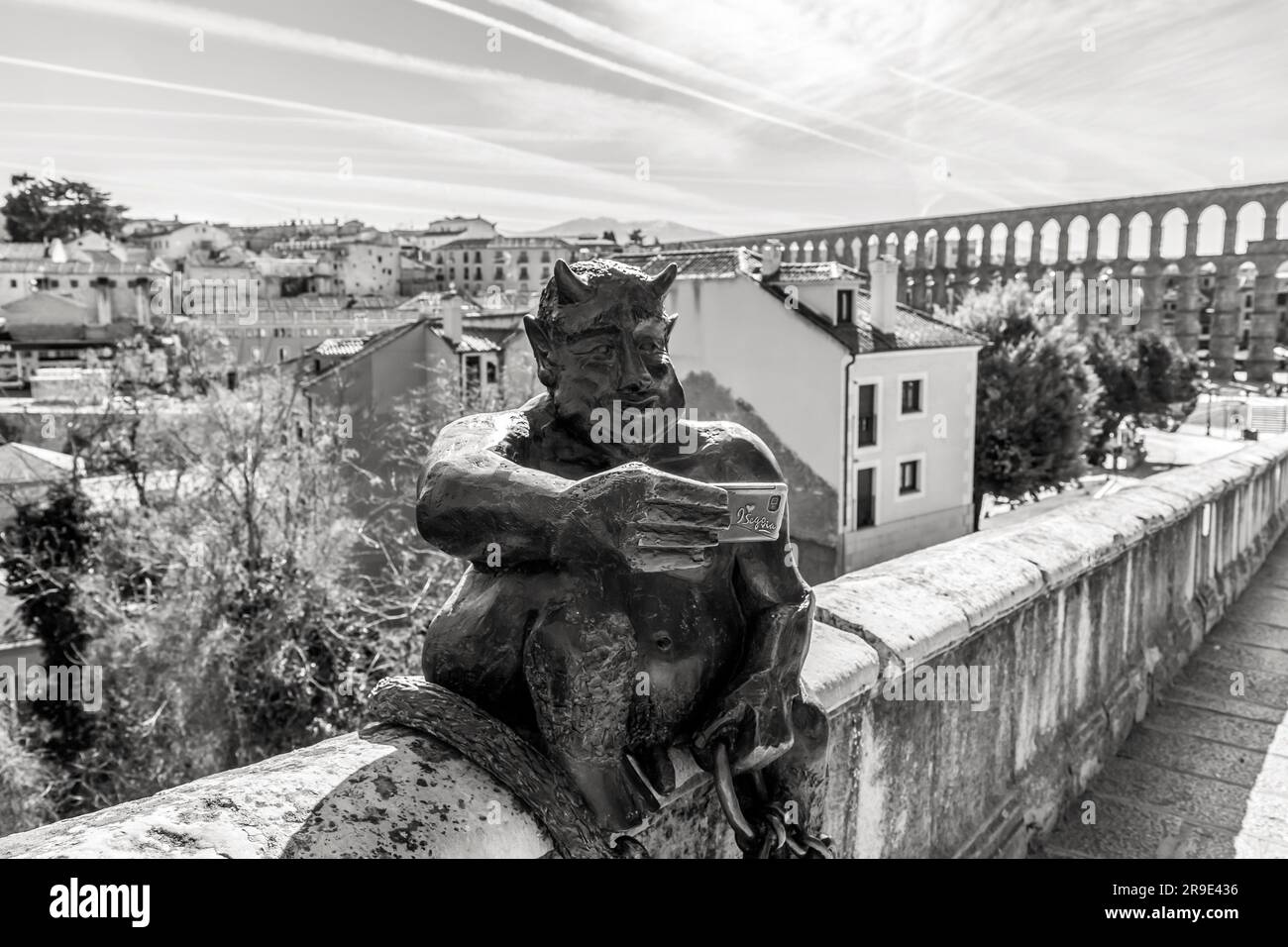 Segovia, Spain - FEB 18, 2022: Funny sculpture of a devil taking a ...
