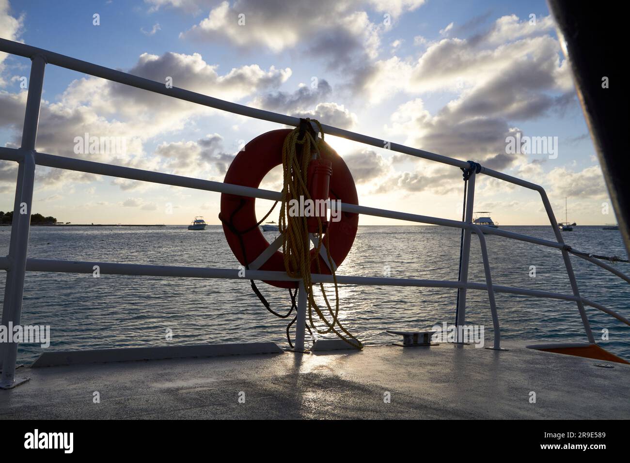 lifebuoy hanging on boat railing Stock Photo - Alamy