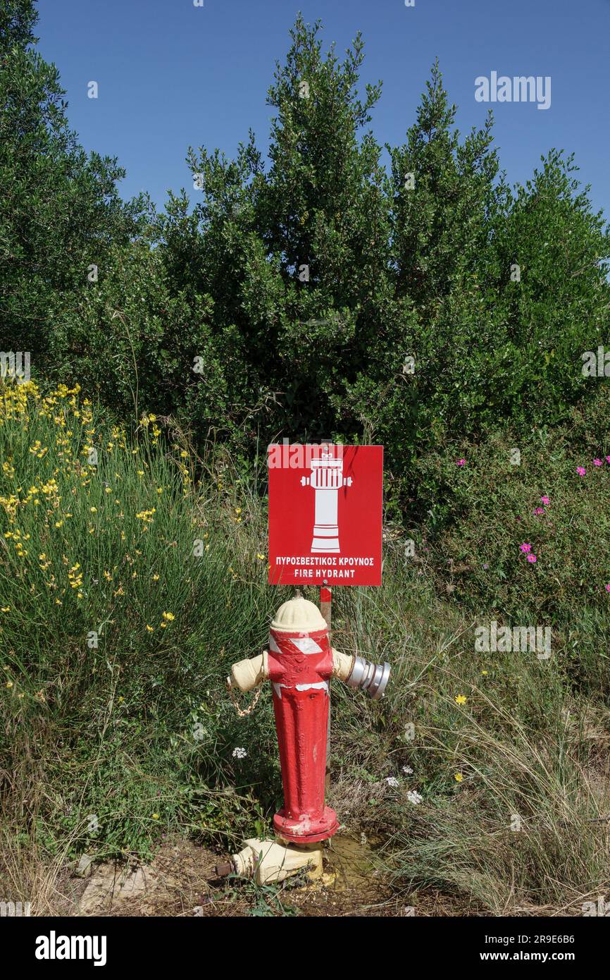 Red painted fire hydrant, Kefalonia,Greece Stock Photo - Alamy
