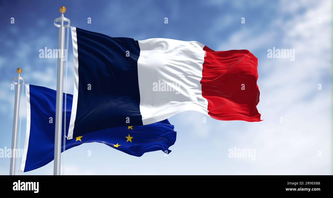 The flags of France and the European Union waving together on a clear ...