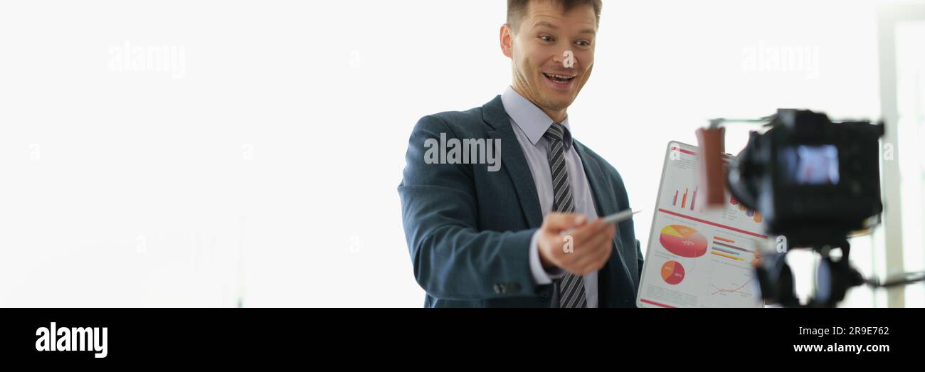 Freelancer business coach showing graphs to camera on video conference ...