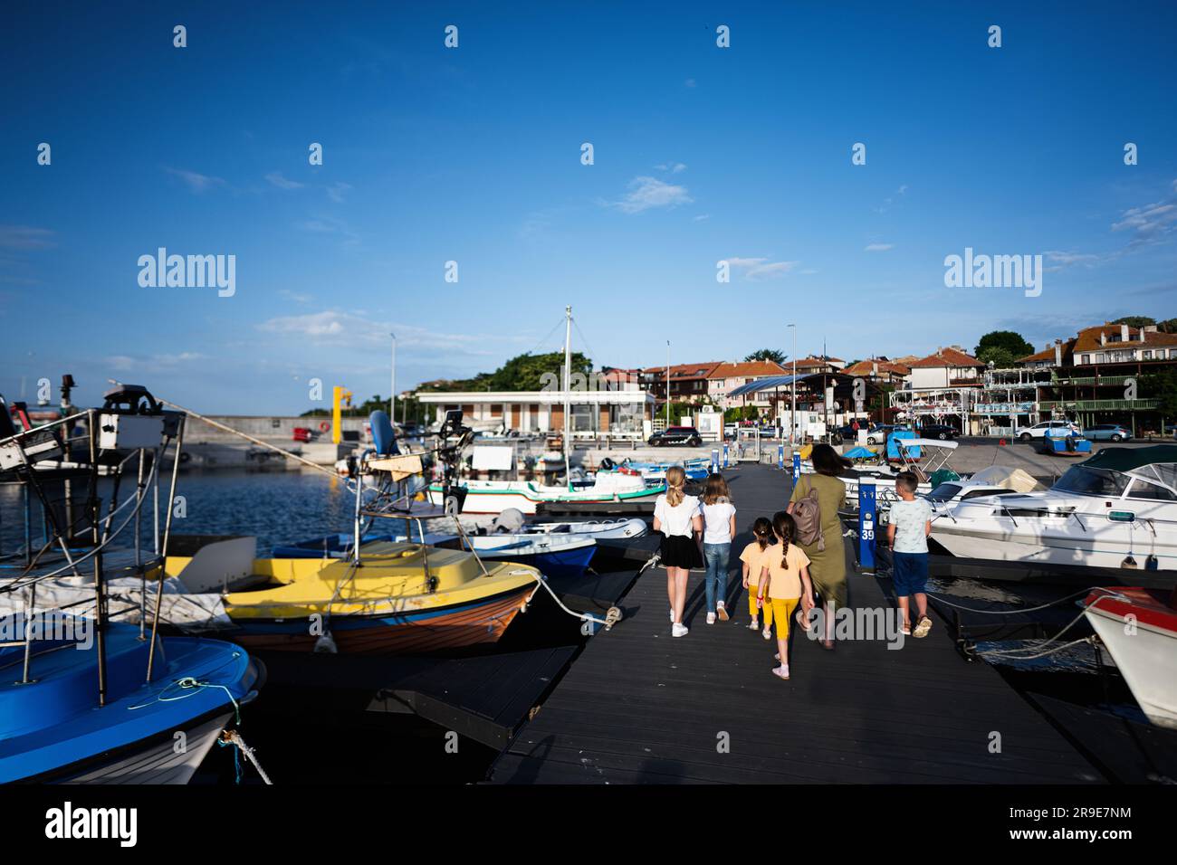 Tourists on a pier in the port of Nessebar, mother with kids Stock ...