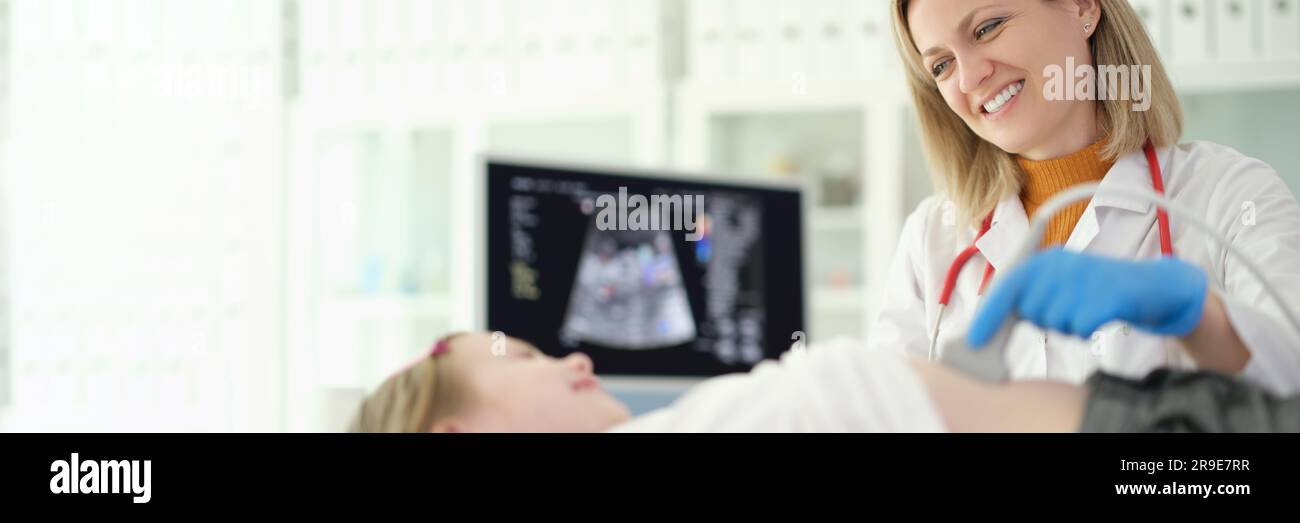 Doctor pediatrician making ultrasound examination of abdominal organs ...