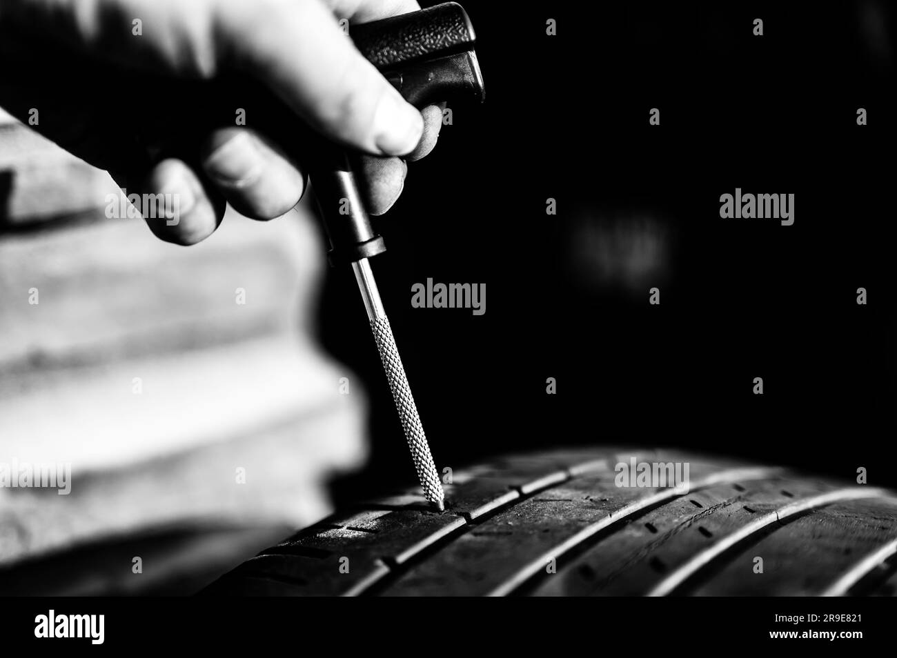 Reaming tool used to scarify and enlarge a tire puncture before ...