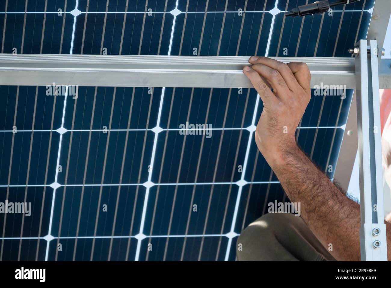 Hand on solar panel hi-res stock photography and images - Alamy