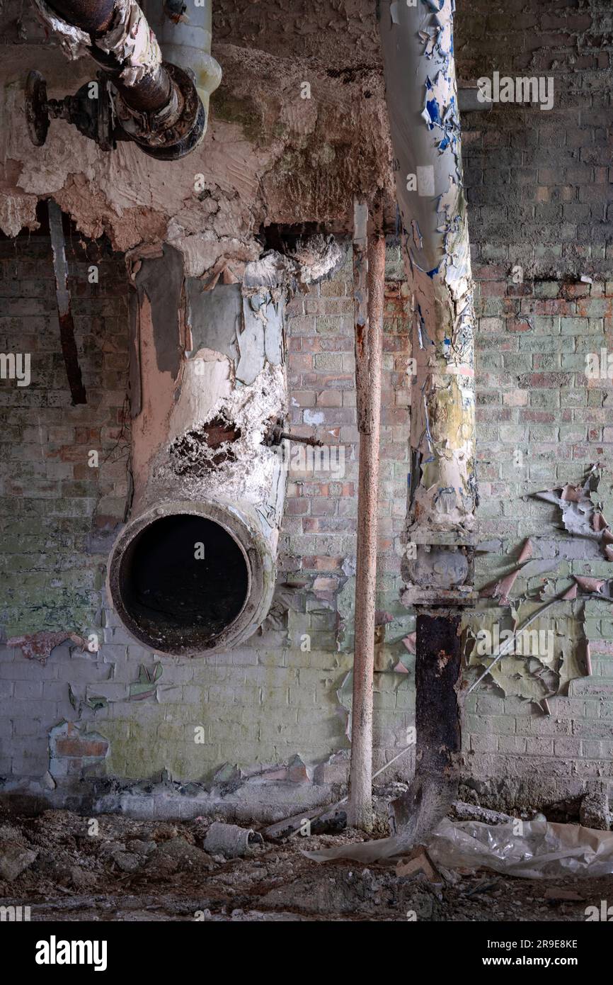 Rotten, rusty pipework in an abandoned boiler house Stock Photo - Alamy