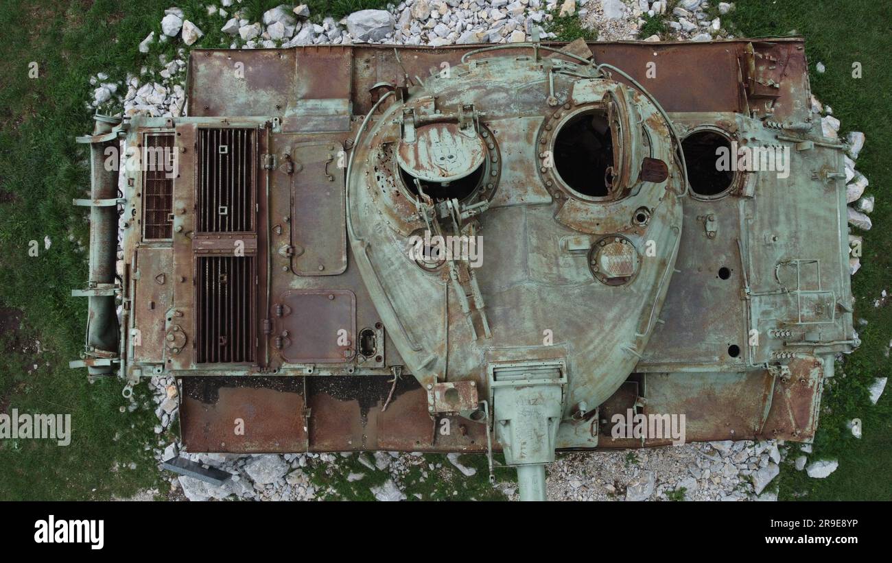 An Aerial view of a rusty vintage military tank in a grassy field Stock ...