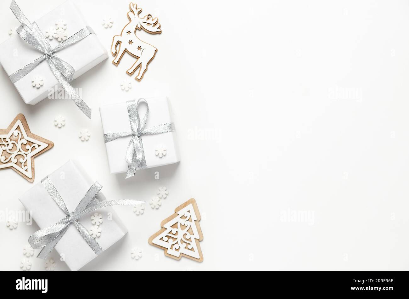 White Christmas decoration in white and silver on white background with ...