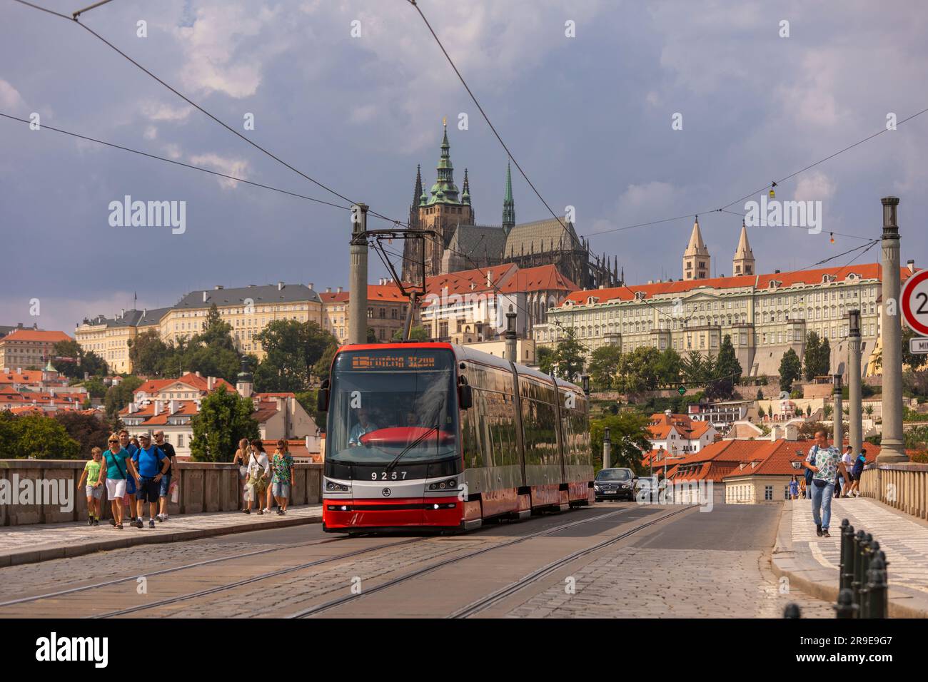 PRAGUE, CZECH REPUBLIC, EUROPE - Tram crosses Manes Bridge. At rear is ...