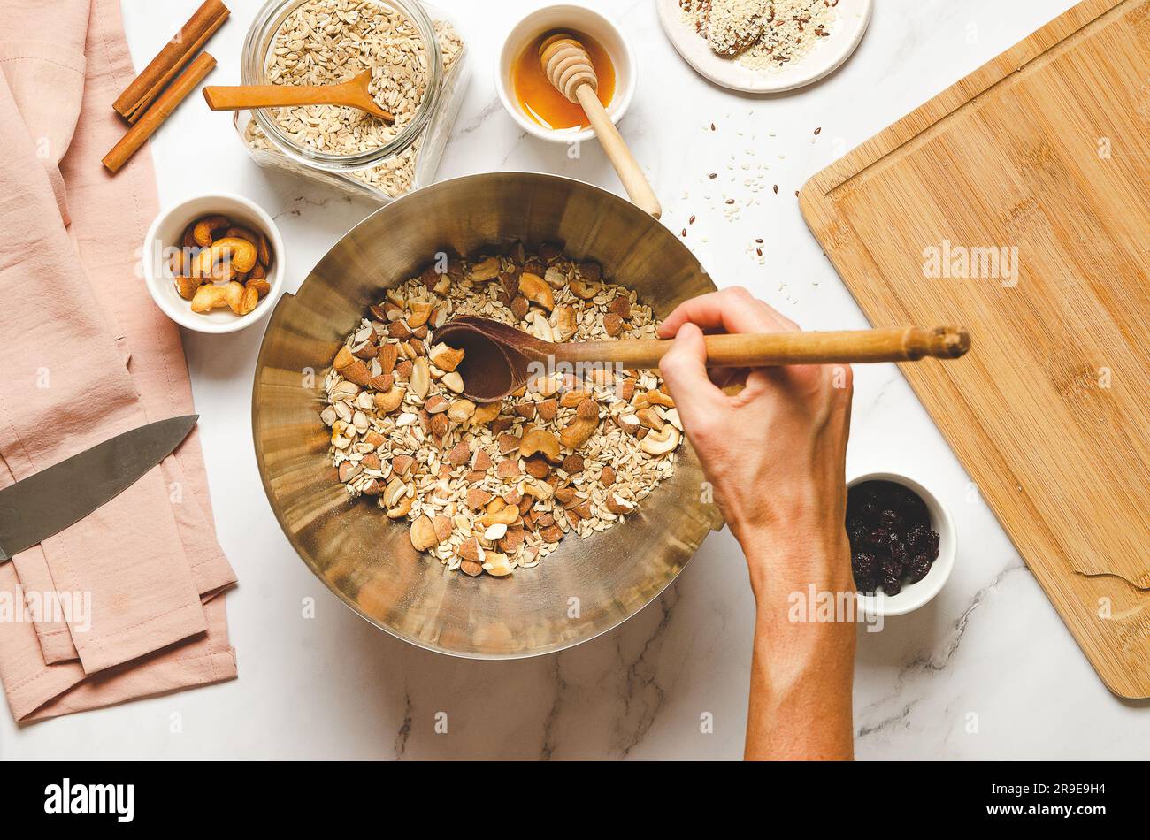 Granola mixing process hi-res stock photography and images - Alamy