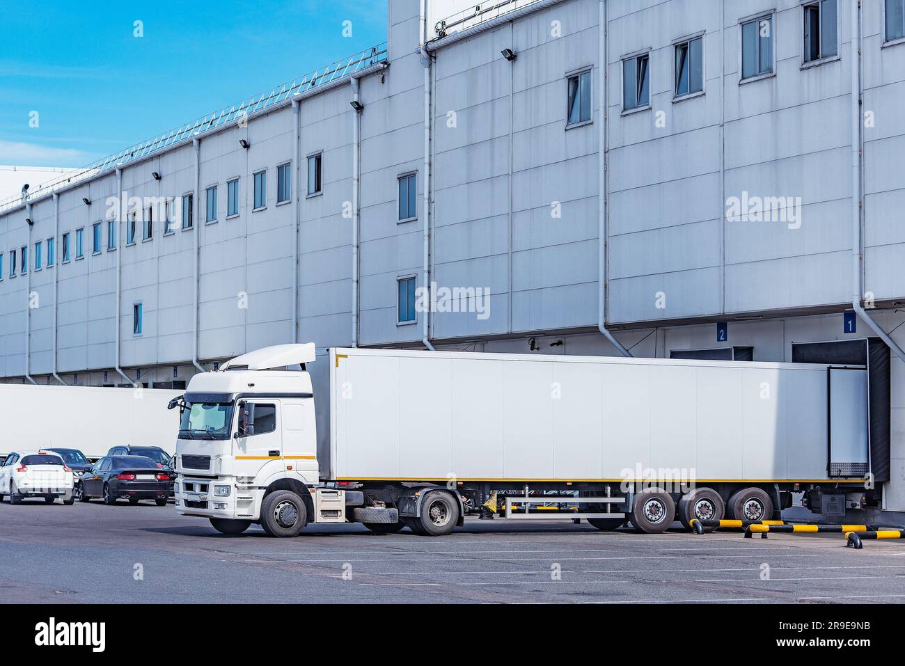 Freight truck stands by the door of the storage Stock Photo - Alamy