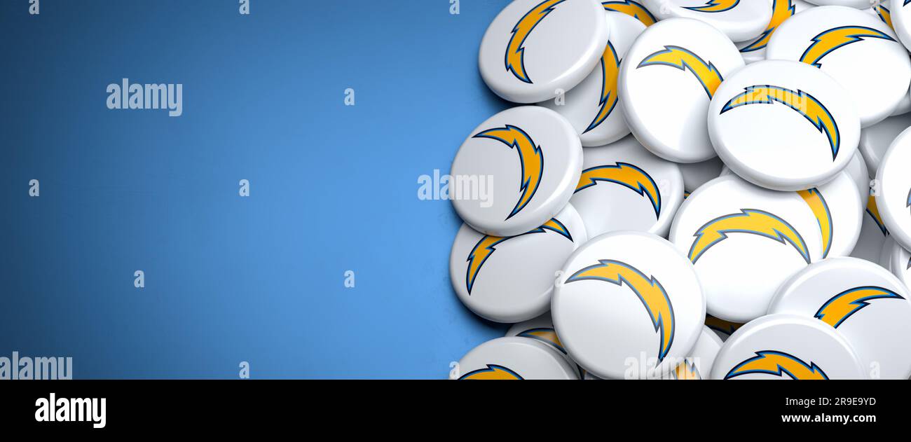 Logos of the American Football Team Los Angeles Chargers on a heap on a ...