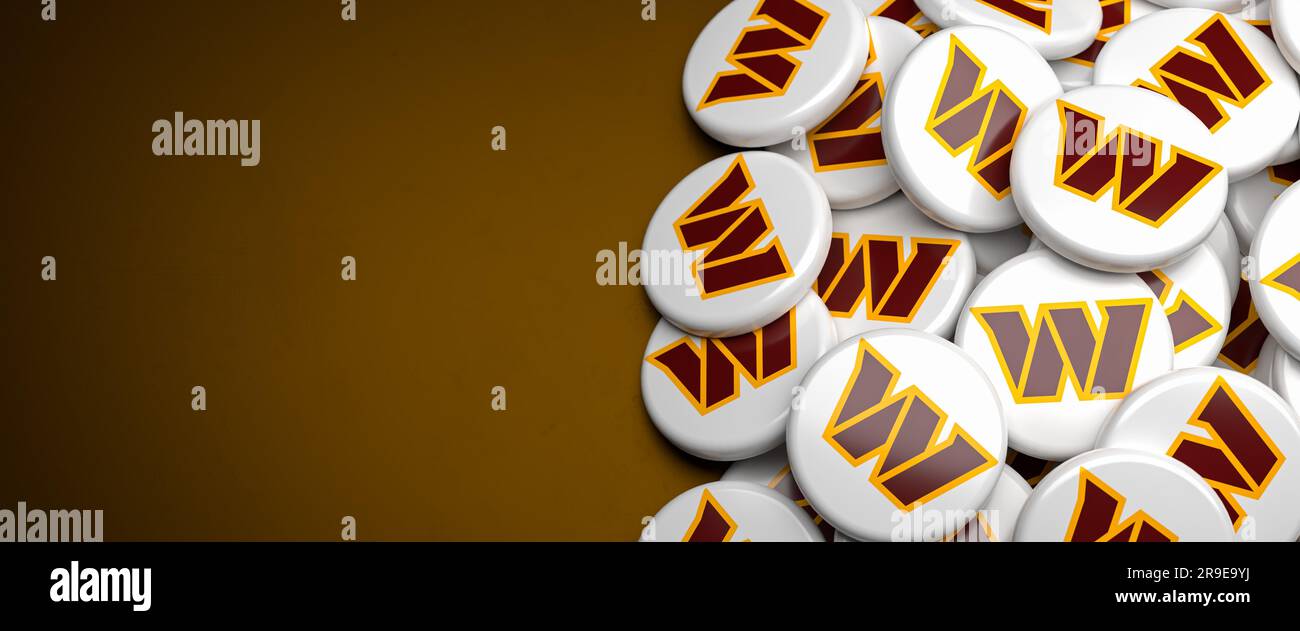 Logos of the American Football Team Washington Commanders on a heap on ...