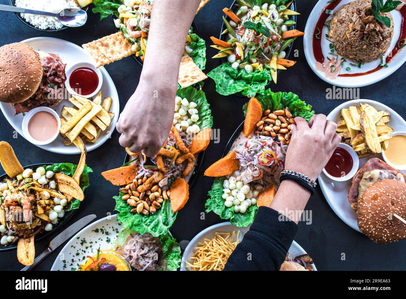Overhead view of a group of people celebrating and eating in a Peruvian ...