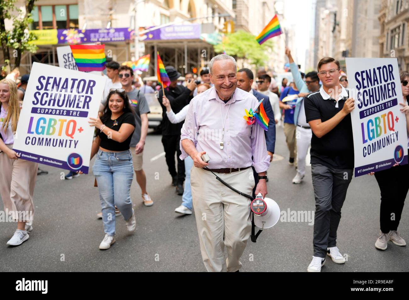 New York Sen. Chuck Schumer walks in the NYC Pride March on Sunday ...