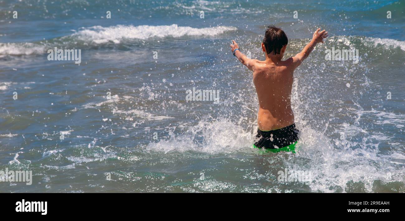 Boy has fun in the sea (Model Released Stock Photo - Alamy
