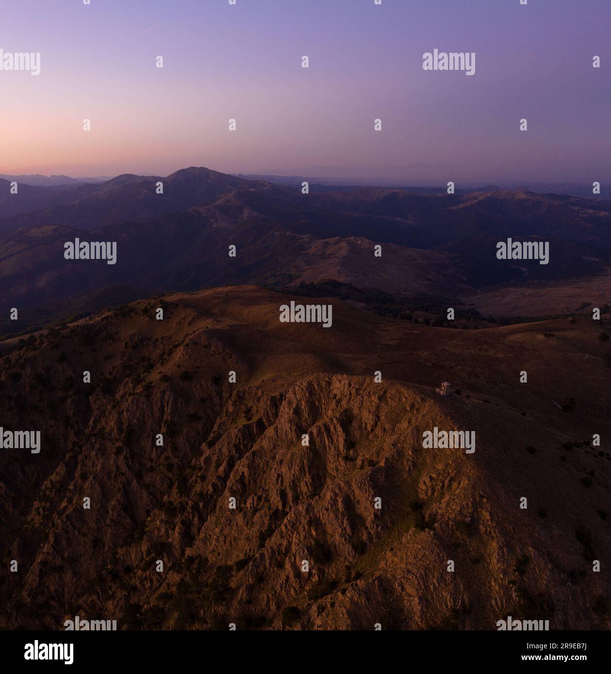 Aerial view of the Pindus mountains during sunset in western Greece ...