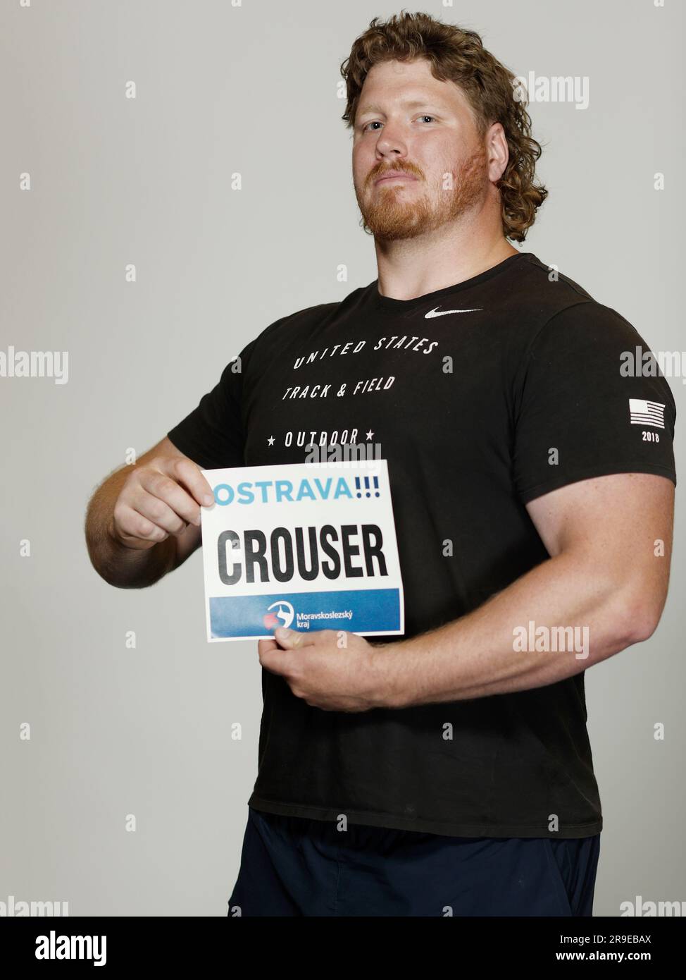 Ryan Crouser (USA) poses with the starting bib of the Golden Spike ...