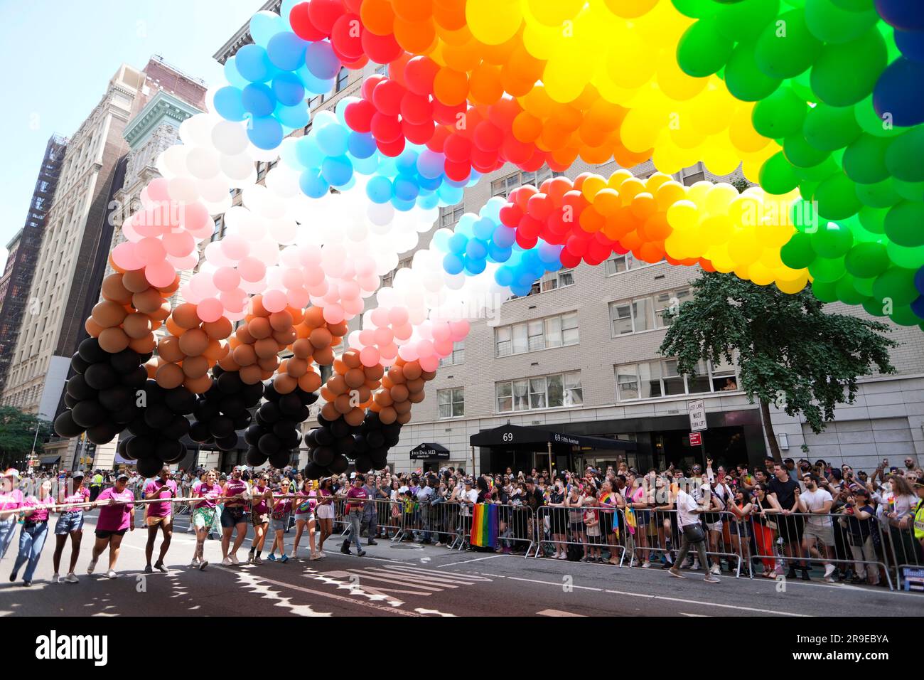 Rainbow balloons are carried down the parade route during the NYC Pride March on Sunday, June 25 ...