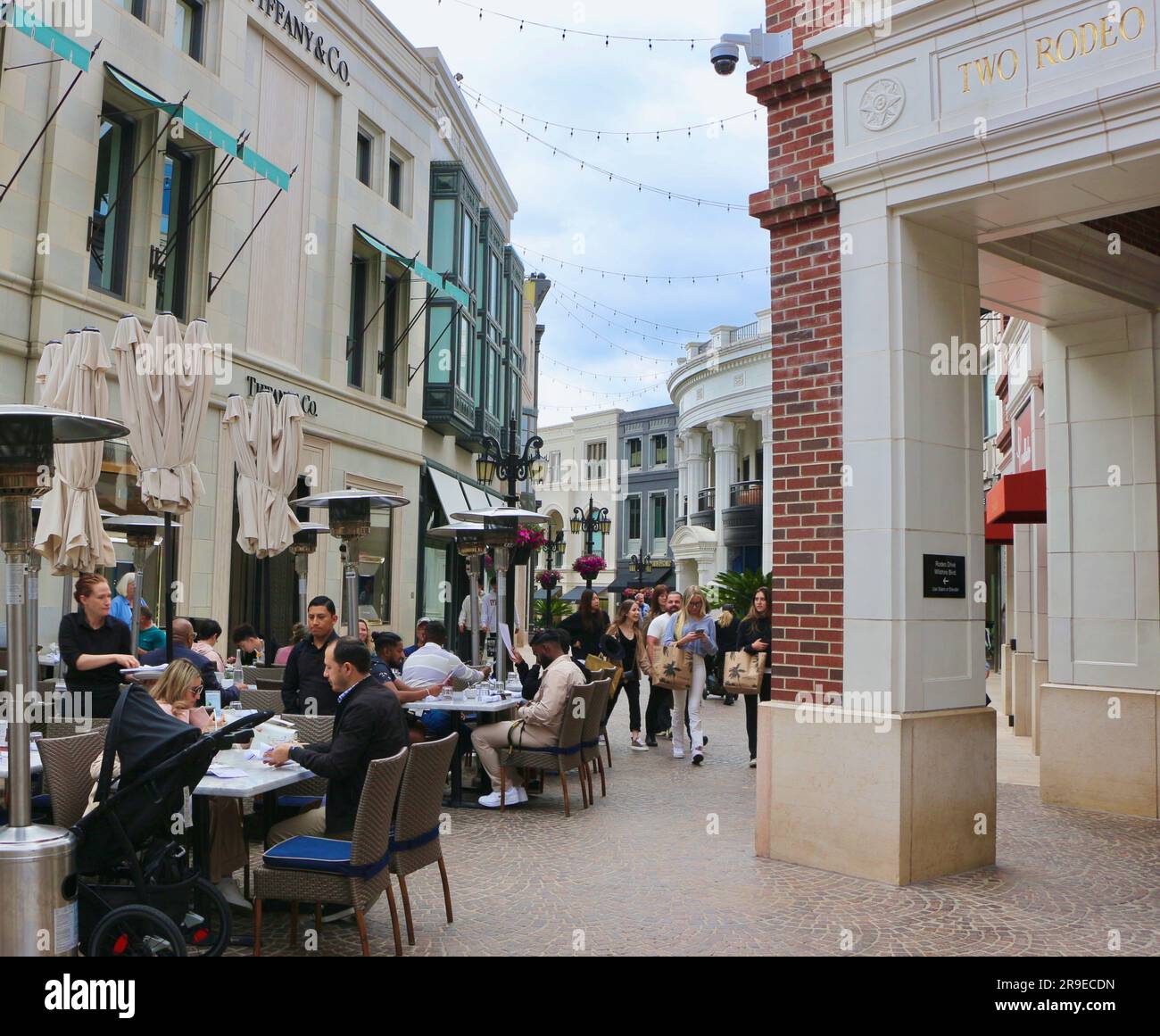 People eating at the Rodeo Restaurant terrace in front of jewellers ...