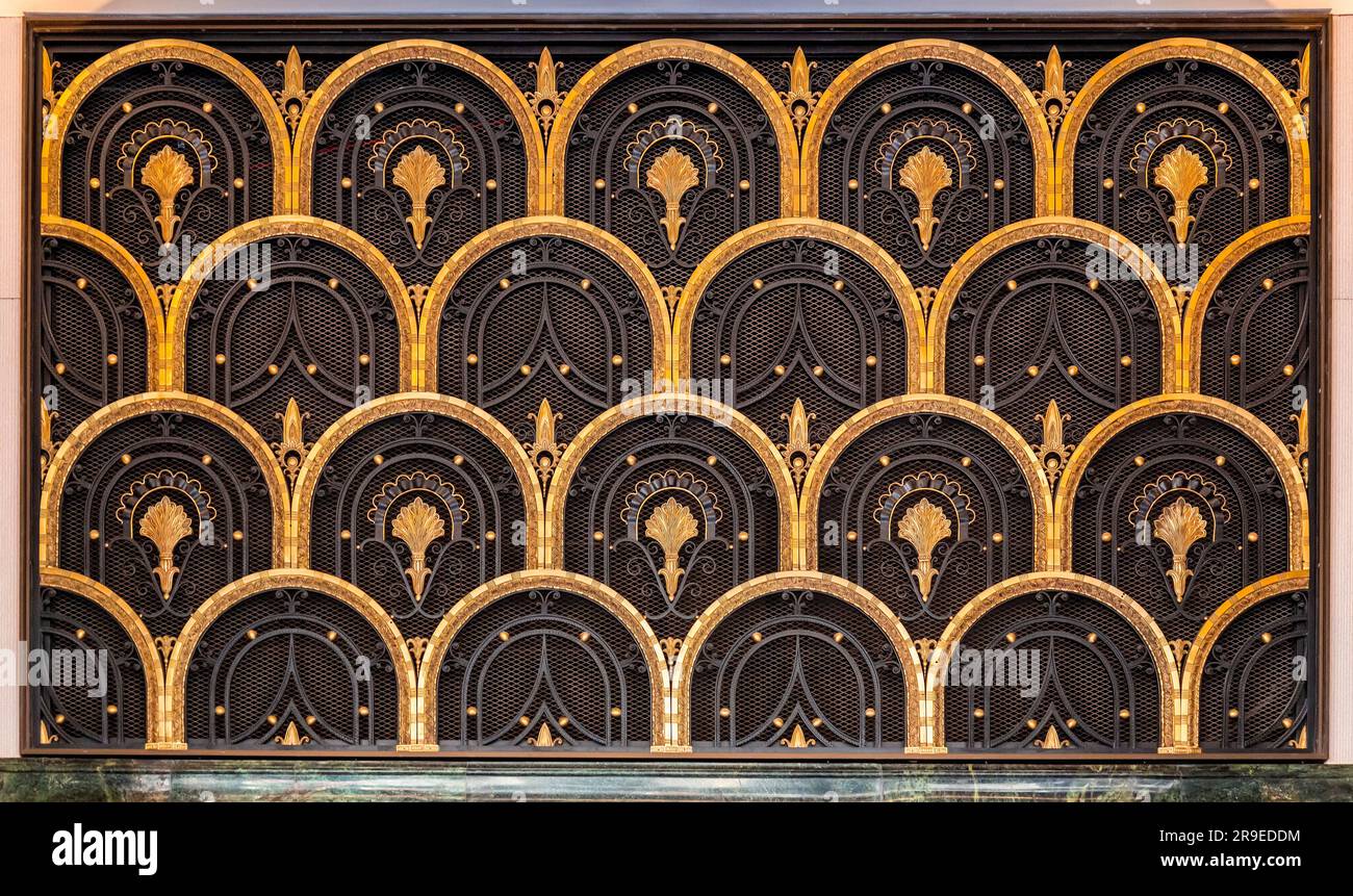 Art deco style European door with gold colored fish scale ornaments ...