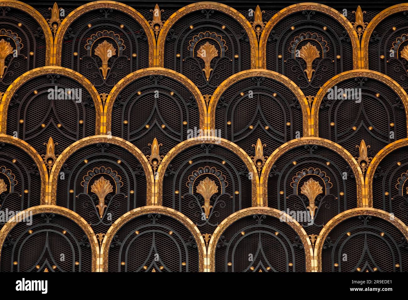 Art deco style European door with gold colored fish scale ornaments ...