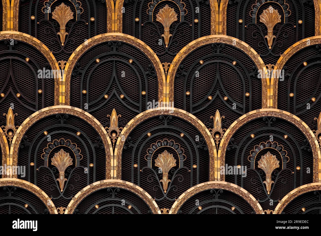 Art deco style European door with gold colored fish scale ornaments ...