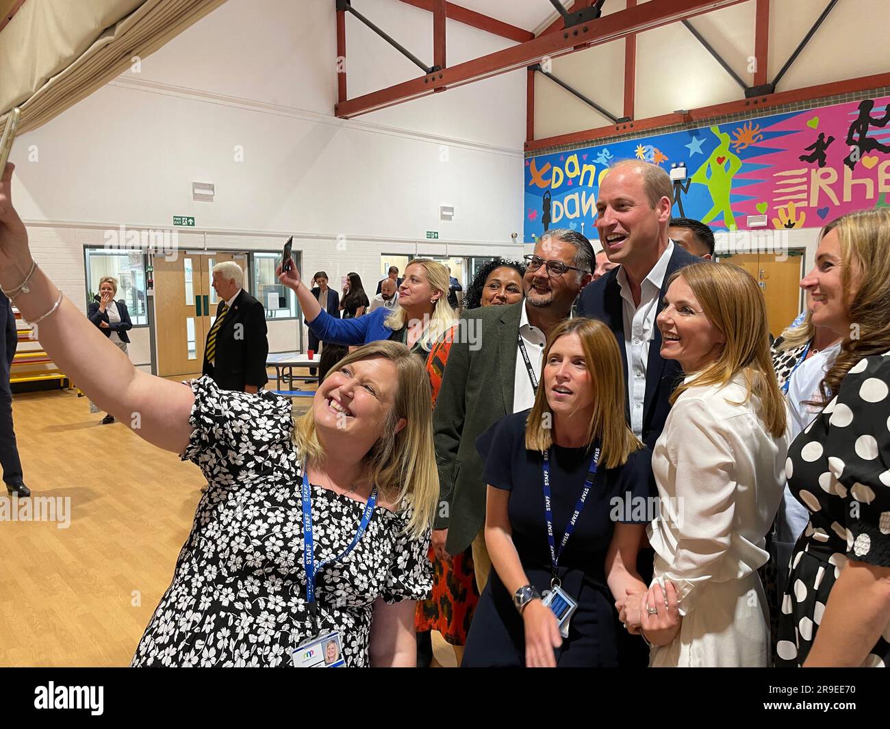 The Prince of Wales poses for a selfie with members of staff and ...
