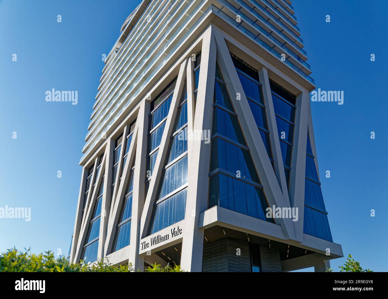 The William Vale hotel rises over truss-enclosed office floors, which ...