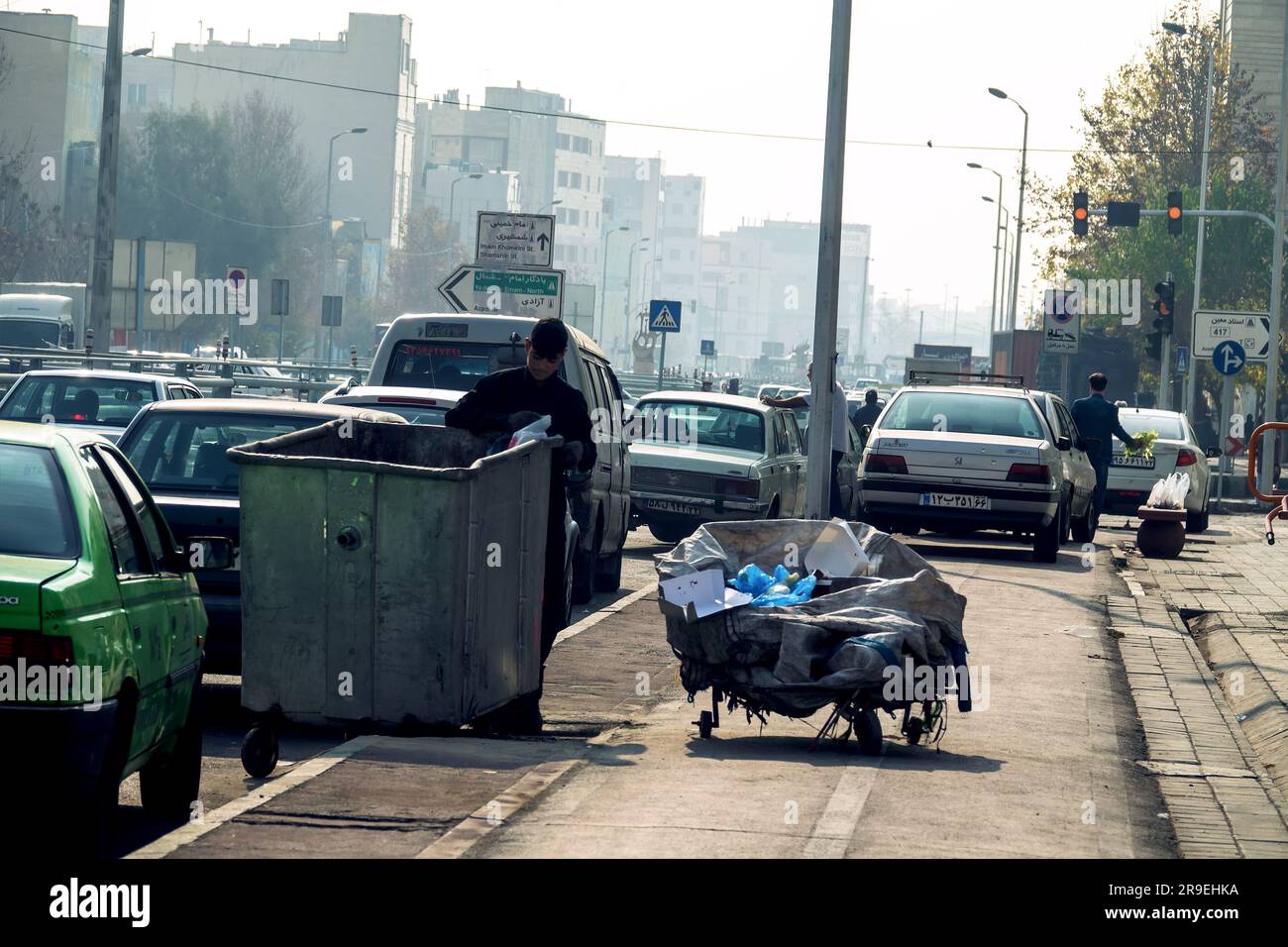 Tehran, Iran- December 19, 2022: Garbage containers and junk man Stock ...