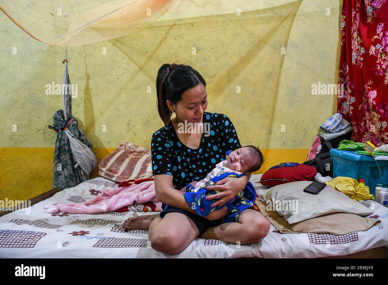 Churachandpur, India. 21st June, 2023. Hoineichong Khongsai (27) poses ...