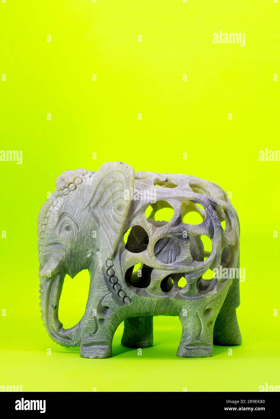 Mother elephant carved in stone Stock Photo - Alamy
