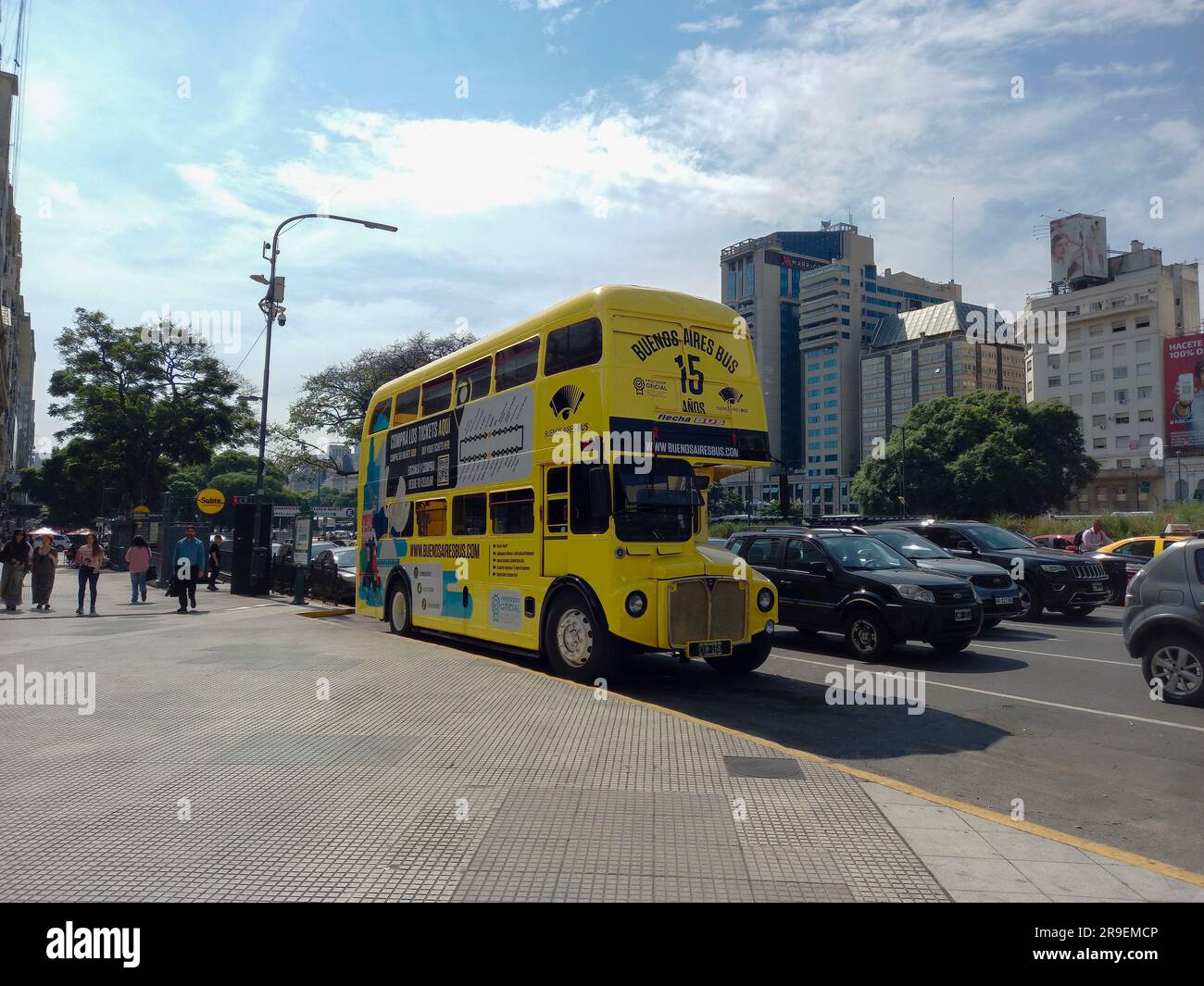 Old yellow double decker touristic bus in the street. Sunny day Stock ...