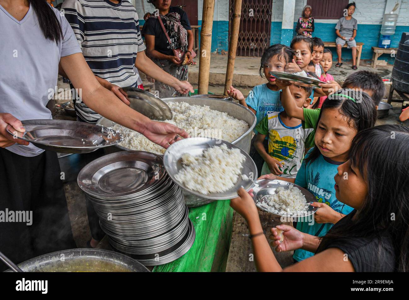 June 21, 2023, Churachandpur, India: Children in a queue receive food ...